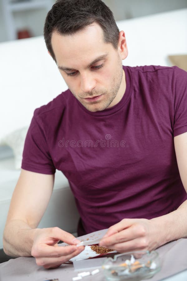 Man Rolling Cigarette with Rolling Tobacco Stock Photo - Image of ...