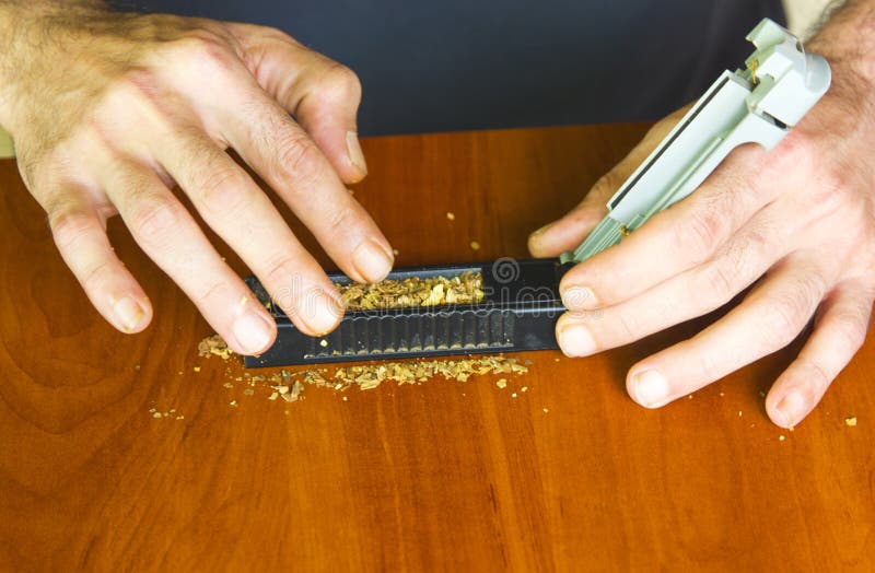 Man Rolling Cigarettes Using Fresh Tobacco Stock Photo - Image of ...