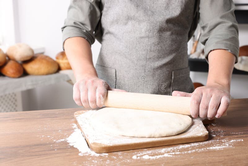 Man Rolling Dough at Table in Kitchen, Closeup Stock Image - Image of ...