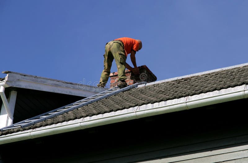 Man on a roof stock image. Image of blue, ladder, roof - 44184653