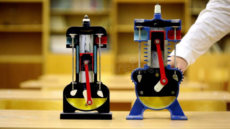 Man Rotates Each of Two Models of Internal Stock Footage - Video of ...