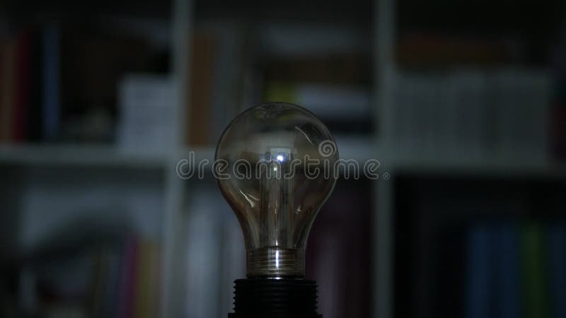 Man Rotates and Unscrew with Hand an Incandescent Light Bulb from His ...