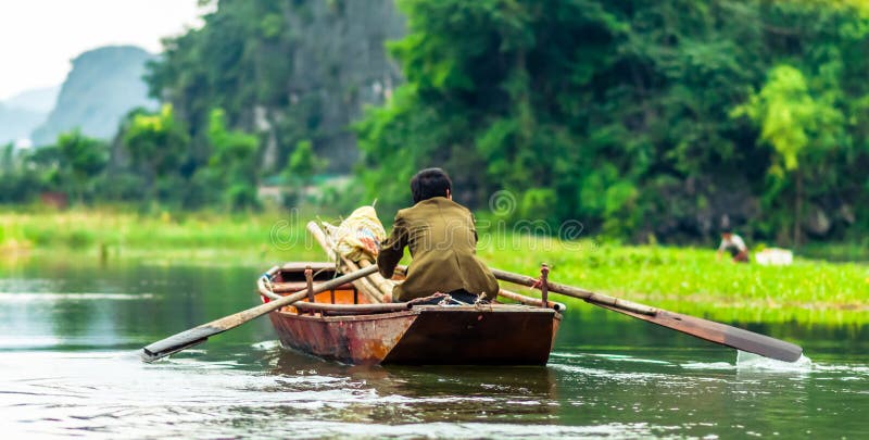Man rowing boat editorial photo. Image of alone, hill - 63214001