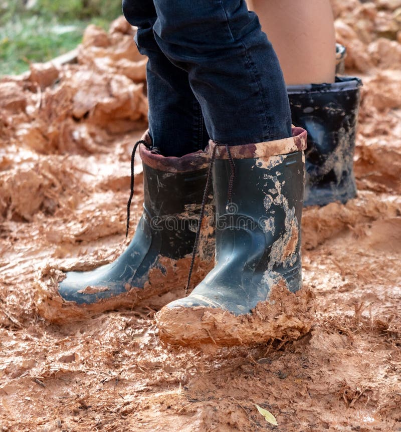 A Man in Rubber Boots Walks on Clay Stock Image - Image of closeup ...