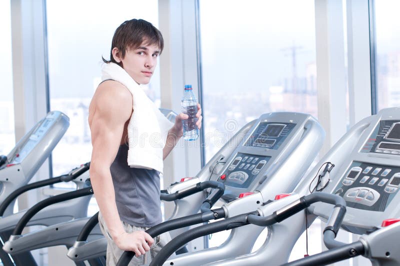 Man Run on on a Machine and Drink Water Stock Image - Image of aerobics ...