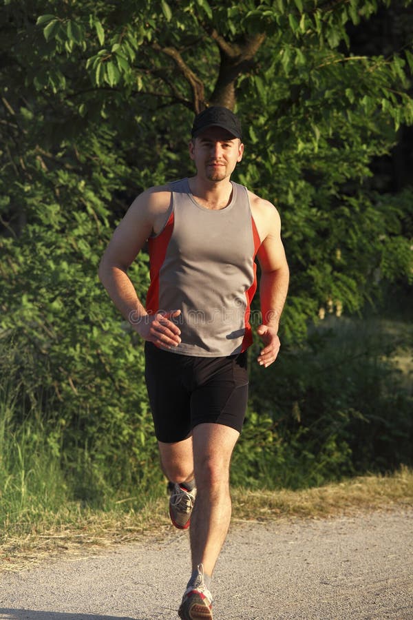 Man run in park stock photo. Image of outdoors, young - 14464498