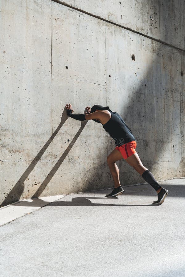 Man Runner Doing Stretching Exercise, Preparing for Morning Workout ...