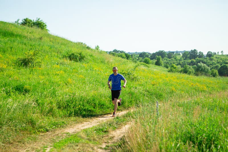 Man Runner Jogging in Rural Scene in Summer Stock Photo - Image of ...