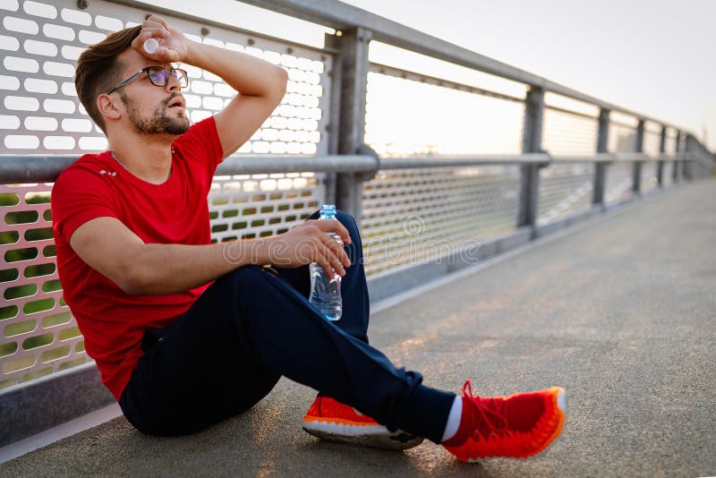Man Runner Taking a Break during Training Outdoors. Jogger Resting ...