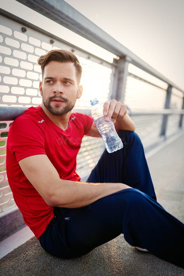 Man Runner Taking a Break during Training Outdoors. Jogger Resting ...