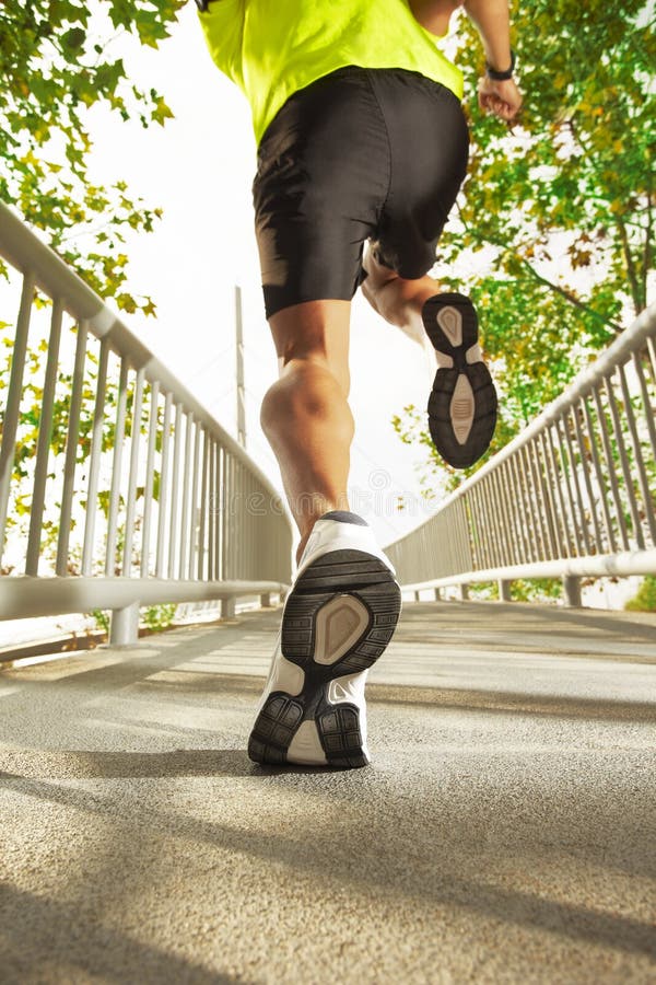 Man Running Across the Bridge Stock Photo - Image of person, fitness ...