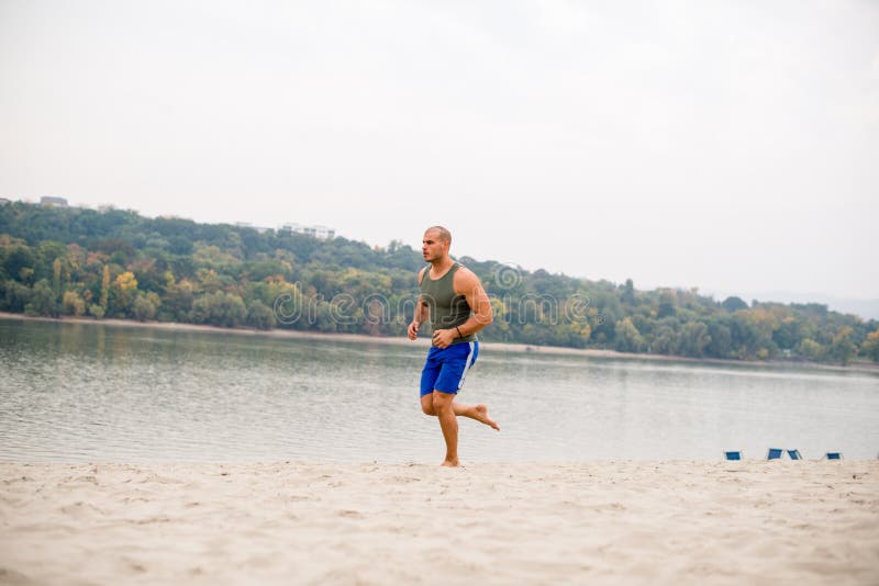 Man Running Along the Beach Stock Image - Image of adult, nature: 110275417