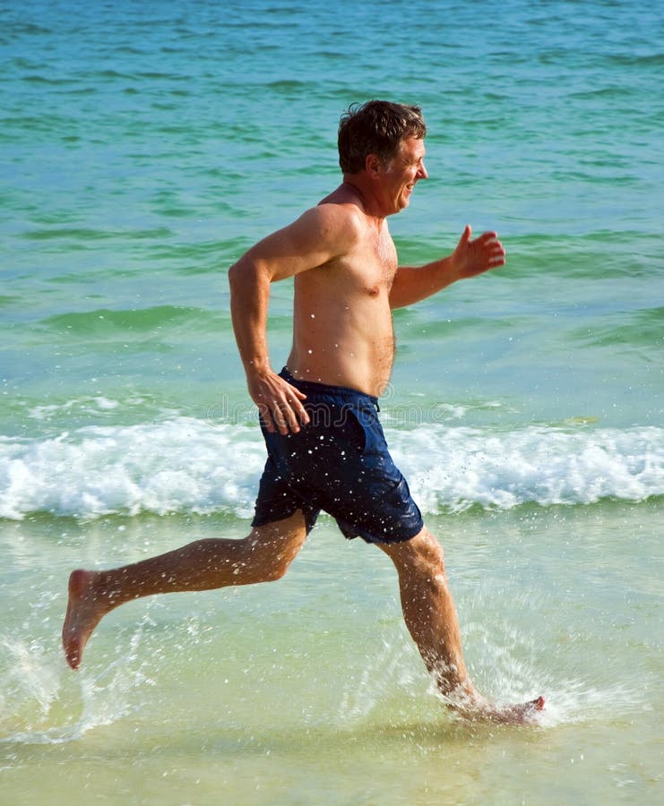 Man is Running Along the Beautiful Beach Stock Image - Image of ...