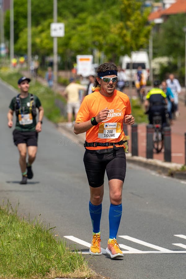 Man Running Along the Road during a Marathon in Leiden. Editorial Image ...