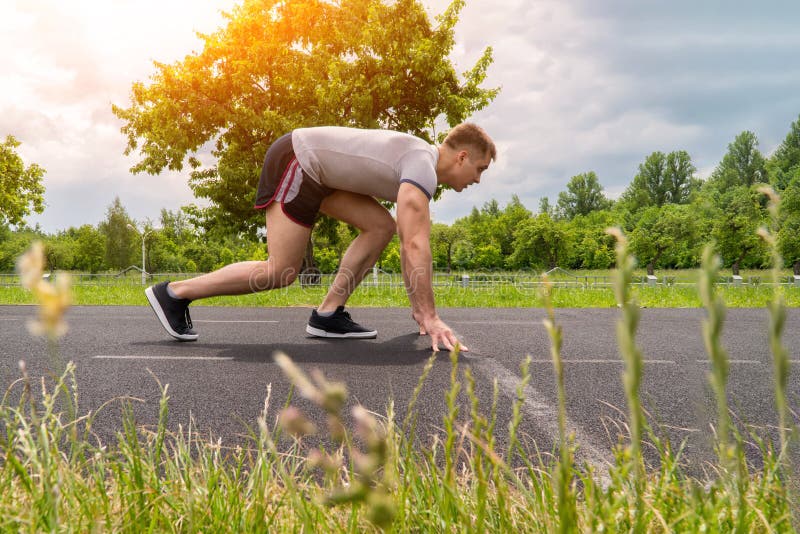 The Man is Running Around the Stadium. Training Outdoors Stock Photo ...