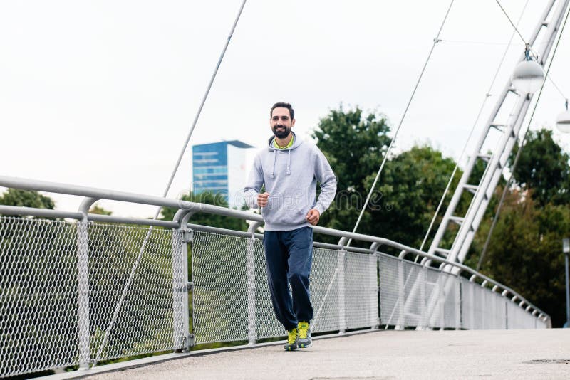 Man Running As Sport in the City Over Bridge Stock Photo - Image of ...