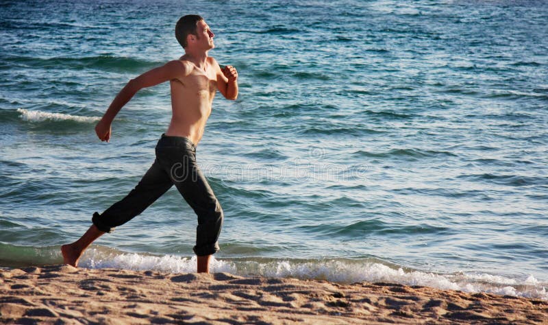 Man running on beach stock photo. Image of adult, attractive - 15801270