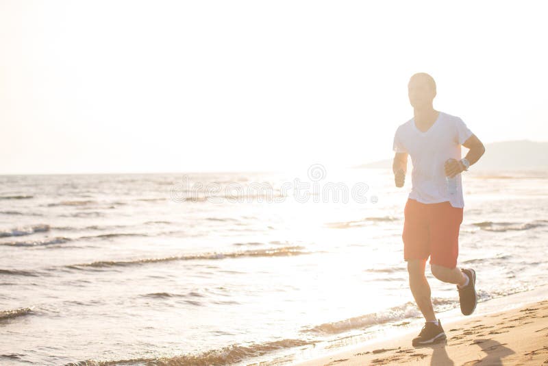 Man Running on the Beach at Sunset Stock Photo - Image of active ...