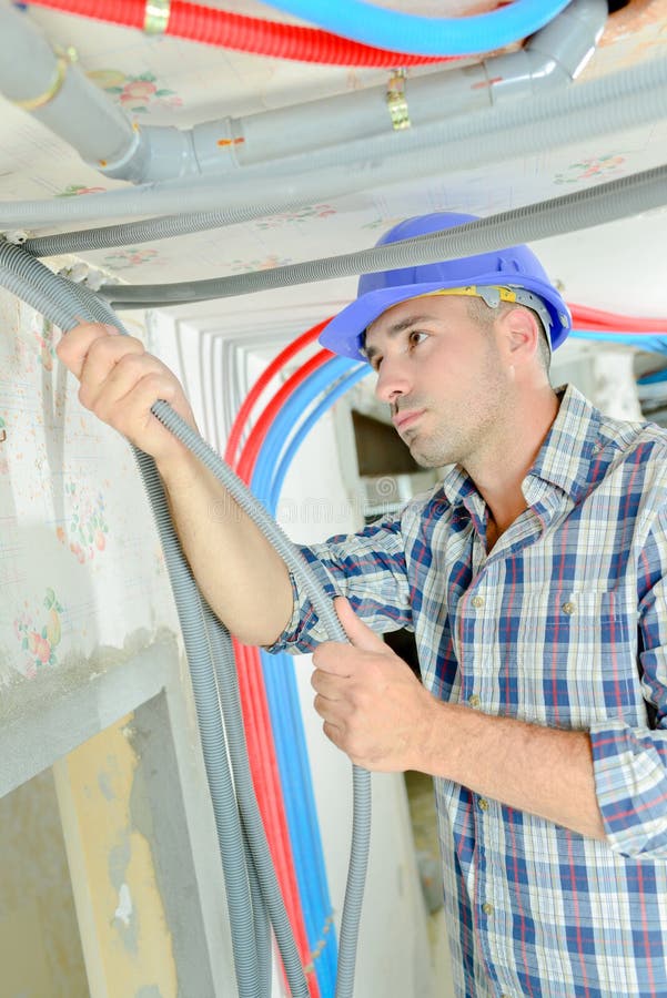 Man running cables stock photo. Image of work, electricity - 165447170