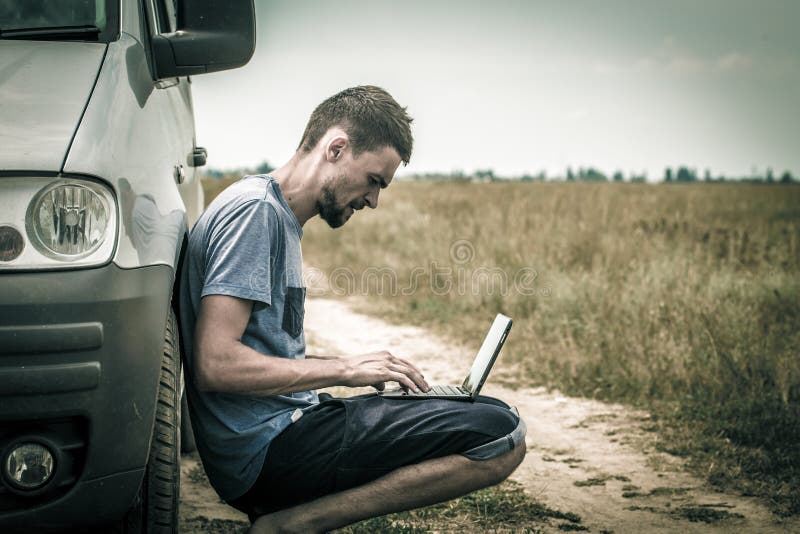 Man Running on the Computer, in Nature Near the Car Stock Image - Image ...