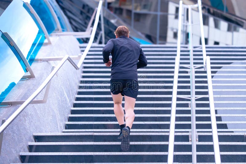 Athlete, Running Down the Stairs, Doing Dynamic Exercise Outdoors Stock ...