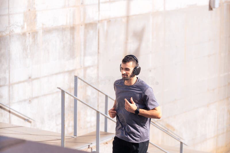Athlete, Running Down the Stairs, Doing Dynamic Exercise Outdoors Stock ...