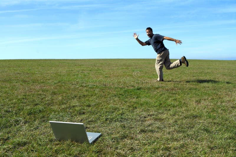 Man Running in Field Near Laptop Stock Image - Image of running, alone ...