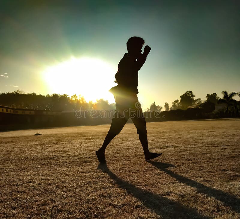 A man running on field stock photo. Image of walking - 165156598