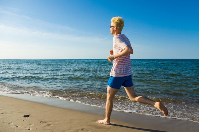 Man Running, Jumping on Beach Stock Photo - Image of lifestyle, sport ...
