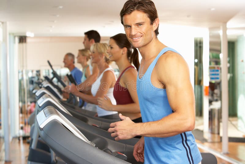 Man on Running Machine stock photo. Image of exercise - 16302012