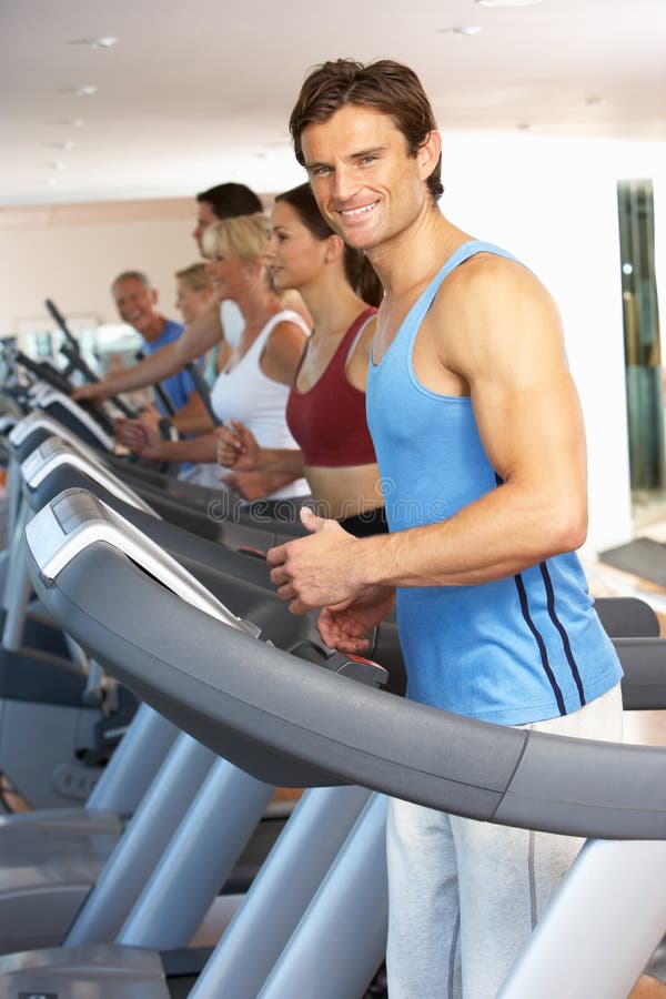 Man on Running Machine stock image. Image of group, treadmill - 16301945