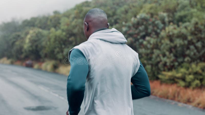 Man, Running and Mountain Road for Cardio Workout in Raining Weather ...