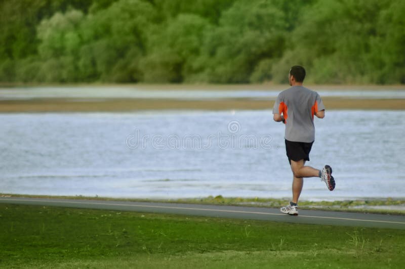 Man running in the park stock image. Image of distance - 1107387