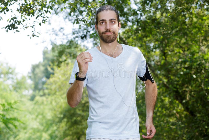 Man running in park stock photo. Image of shirt, running - 204735930