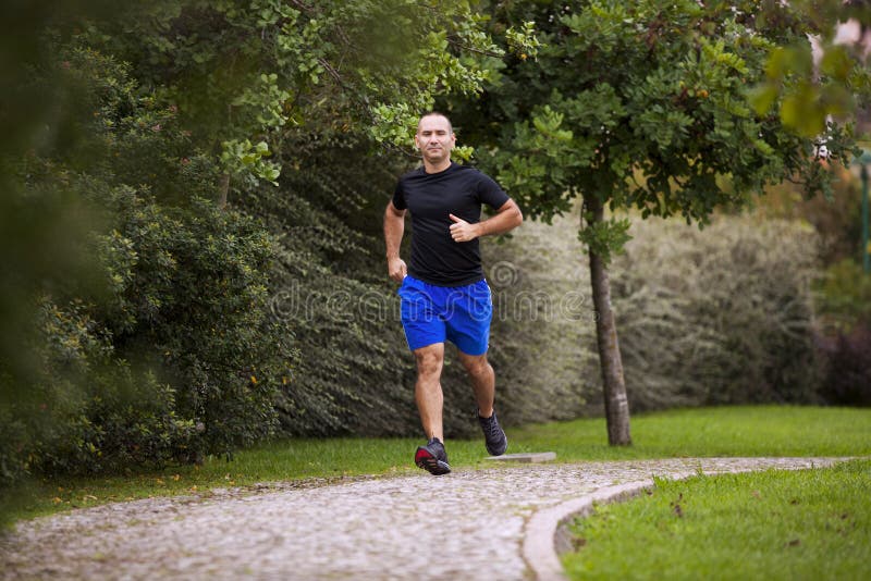 Mature Man Running at the Park Stock Image - Image of male, movement ...