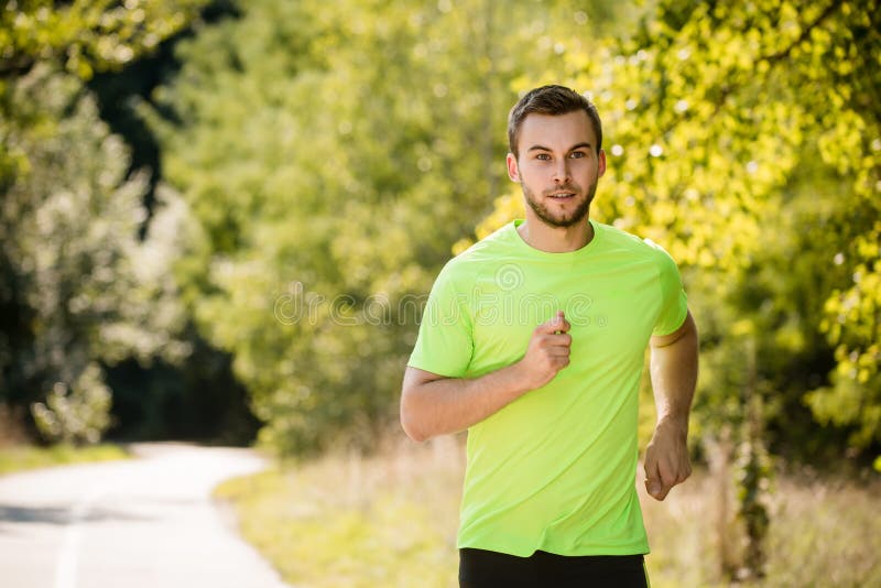 Man running in park stock image. Image of jogger, outdoor - 69181913