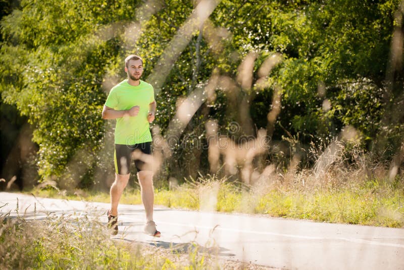 Man running in park stock image. Image of people, exercise - 70671345