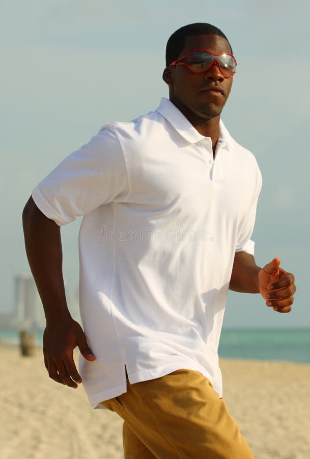 Man in running position stock photo. Image of african - 4677946