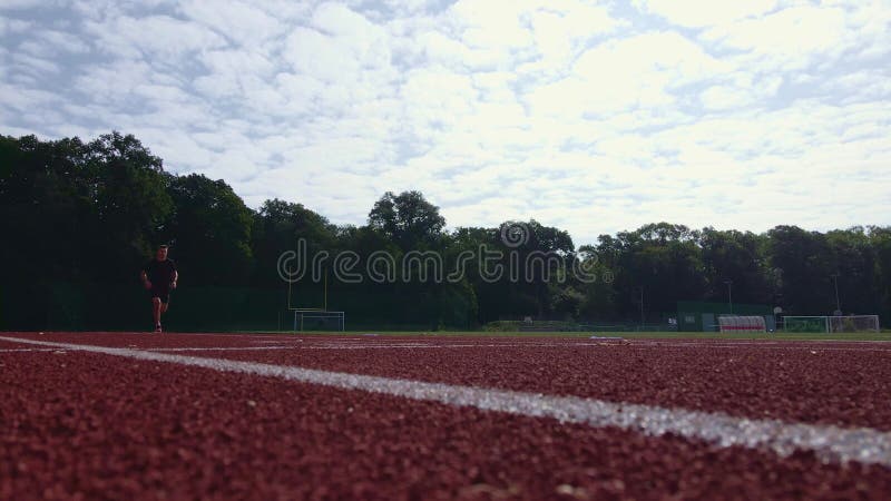 Man Running at Race Track at Stadium Stock Video - Video of track ...