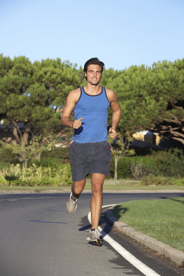 Man Running on Road stock image. Image of exercise, caucasian - 55890671
