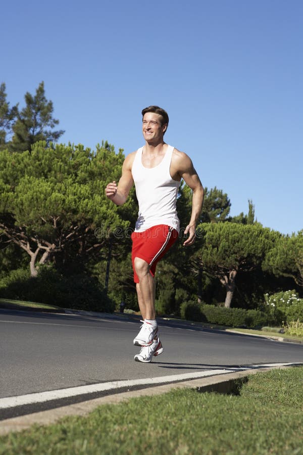 Man Running on Road stock image. Image of sports, park - 55890715