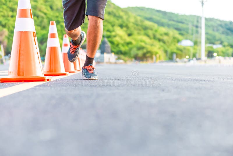 A Man Running on the Road and Mountain Back. Stock Photo - Image of ...