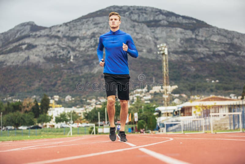 Man Running on a Running Track Stock Photo - Image of sport, marathon ...