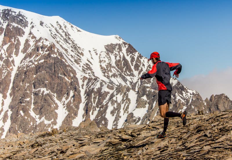 Man Running on a Rural Road during Sunset in the Mountains Stock Image ...