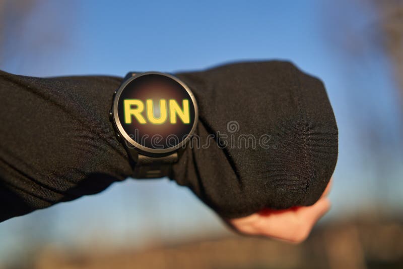 Man Running with Smartwatch Stock Photo - Image of active, park: 303687794