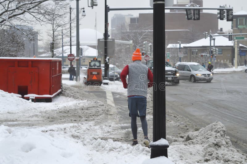 Man Running after Snow Storm Stock Image - Image of winter, urban ...