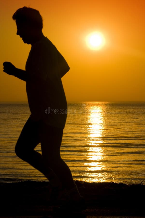 Man Running at Sunrise stock image. Image of jogging, beauty - 5114587