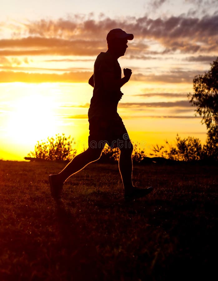 Man running at Sunset stock image. Image of silhouette - 65312823