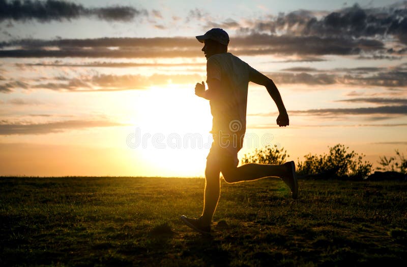 Man running at Sunset stock image. Image of exercise - 69479753