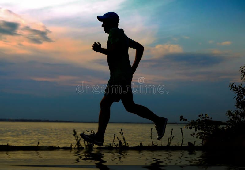 Man running at Sunset stock photo. Image of jogging, athletic - 70035630